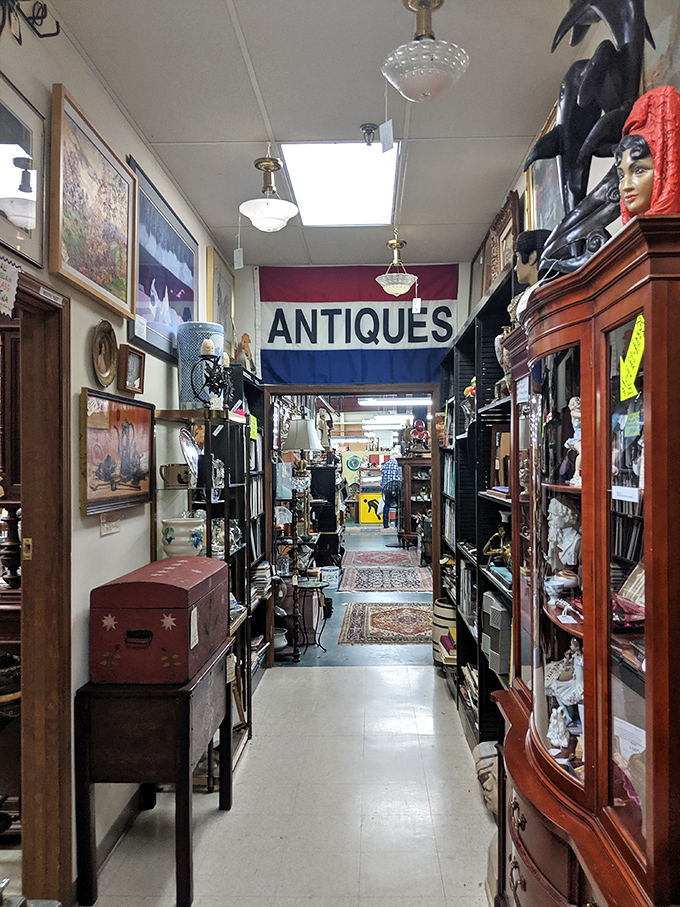 Narrow pathways lead to unexpected discoveries. That "ANTIQUES" banner is like a promise of adventures to come.