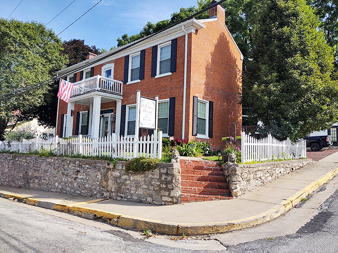 The Hatchery House stands proudly behind its white picket fence, a brick testament to when homes were built with tomorrow in mind.