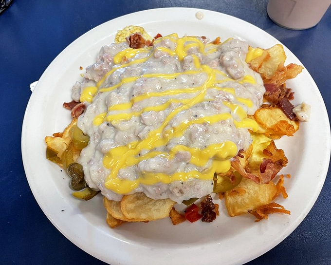 The "Haystack"&mdash;where breakfast meets architectural ambition. Layers of potatoes, eggs, and gravy creating a delicious monument to morning indulgence.