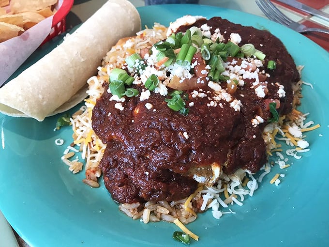 Rice, beans, and rich sauce create the perfect stage for these huevos rancheros, topped with enough cheese to make your cardiologist wince.