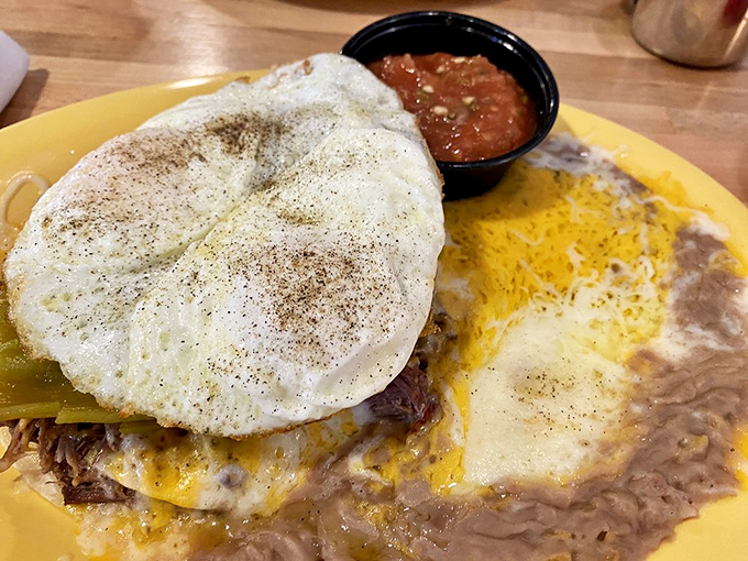 Huevos Rancheros that would make abuela proud. This yellow plate holds the perfect marriage of California and Mexican breakfast traditions.