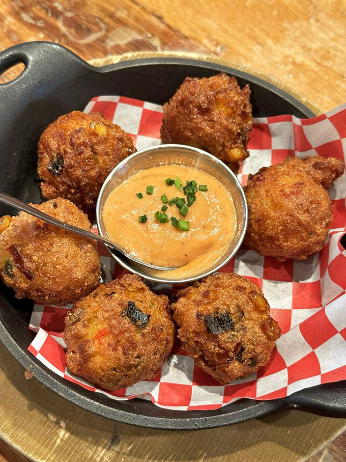 Hush puppies that actually make you want to shout&mdash;crispy, golden orbs of cornmeal joy served with a dipping sauce worth fighting over.