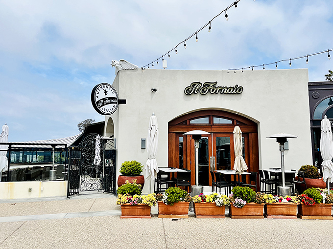 Il Fornaio's patio practically demands you linger over espresso while pretending you're discussing important Italian business matters.