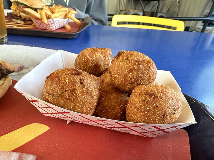 Golden orbs of happiness. These jalape&ntilde;o hush puppies are the perfect combination of crunch, spice, and everything nice&mdash;southern comfort with a kick.