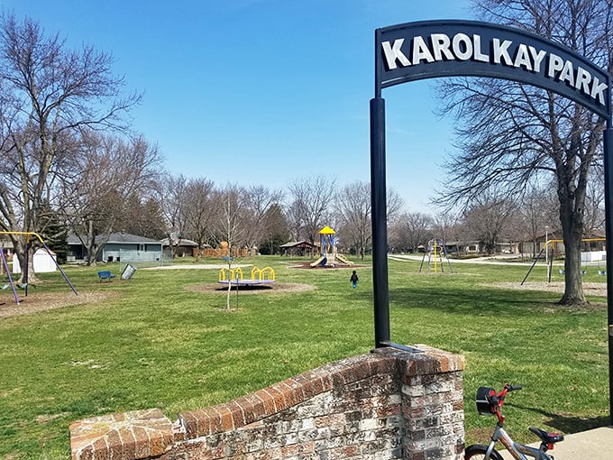 Karol Kay Park's entrance promises simple pleasures &ndash; swings, slides, and the timeless joy of watching children discover the magic of outdoor play.