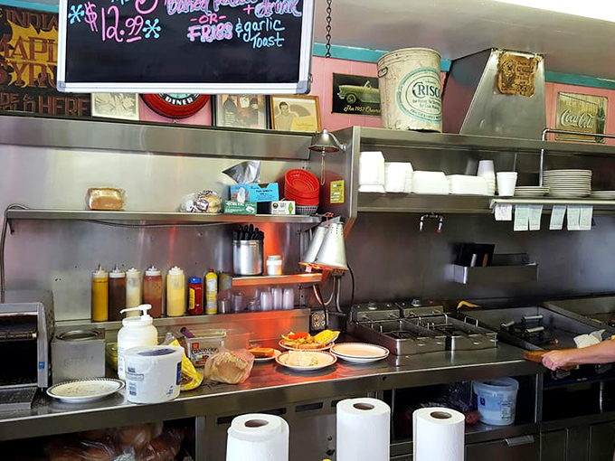 The kitchen &ndash; where diner magic happens. No molecular gastronomy here, just honest cooking that's been perfecting happiness since the Eisenhower administration.