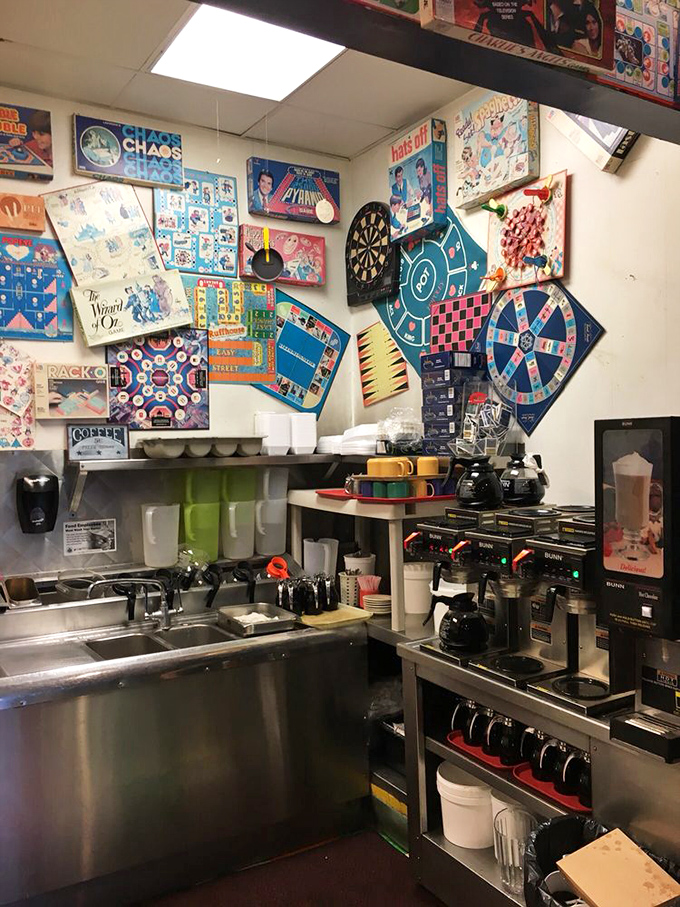 Behind the scenes, where the pancake magic happens – a kitchen wall adorned with games that nobody's playing because they're too busy cooking.