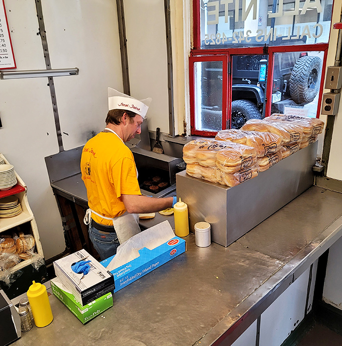The yellow-shirted cook works his magic on the flat-top grill, a craftsman practicing an art form that's increasingly rare in our world of automated everything.