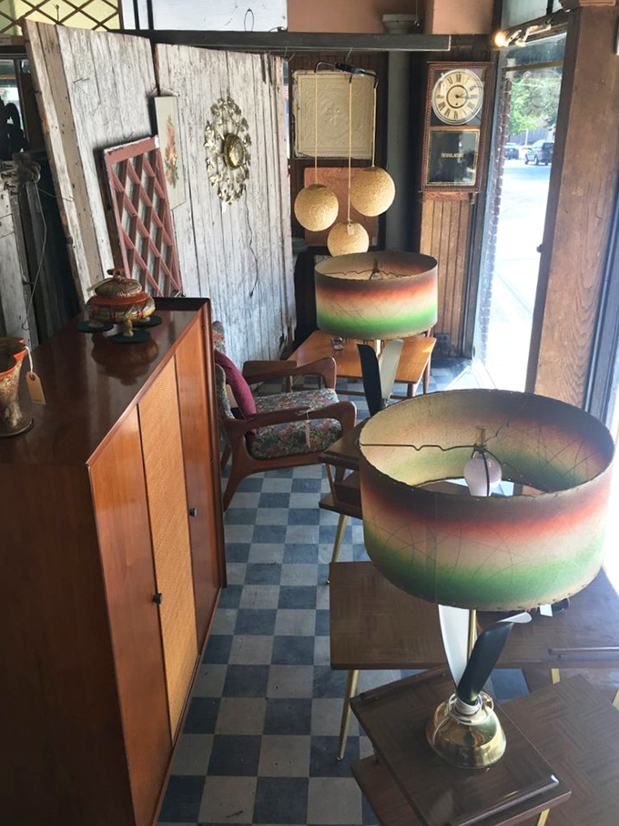 Mid-century lamps with their gradient shades cast the kind of warm glow that Instagram filters try desperately to replicate.