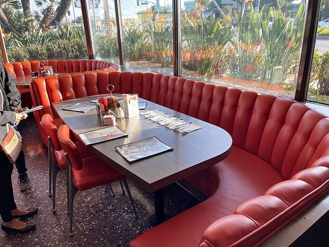 These curved booths aren't just seating&mdash;they're conversation incubators where decades of Los Angeles stories have been shared over coffee.