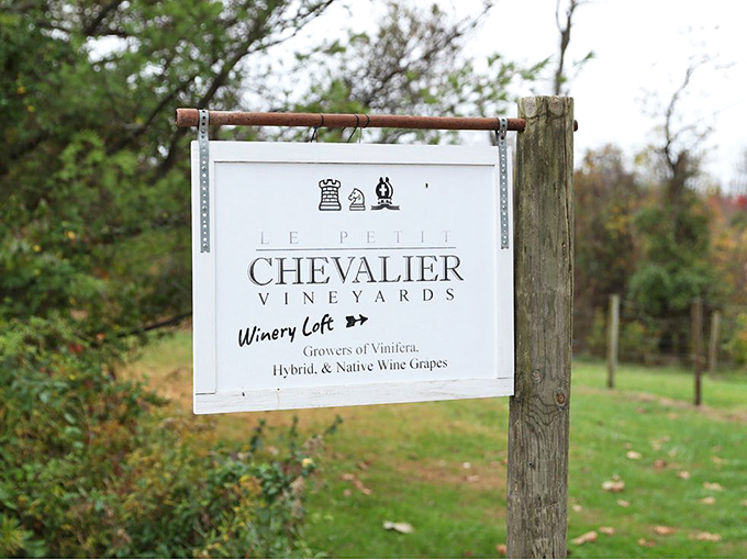 The sign points the way to liquid happiness. Those chess pieces on the logo aren't just decoration&mdash;they're a reminder that good wine is always a strategic move.