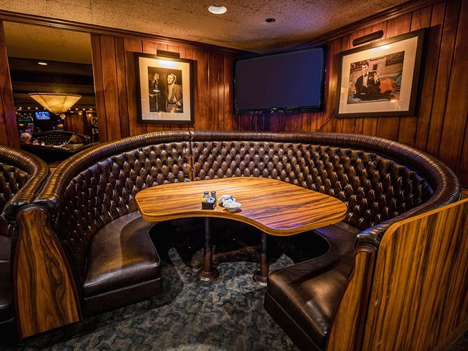 These curved booths aren't just seating&mdash;they're cocoons of comfort where time slows down and food tastes better. Wood paneling adds vintage charm.