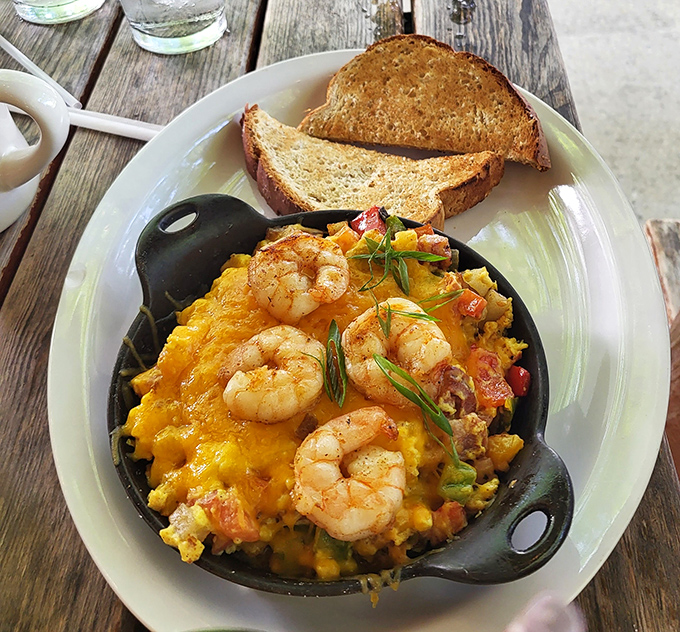 Skillet sorcery at its finest! These shrimp nestled among eggs and vegetables create the breakfast equivalent of hitting all green lights on your morning commute.
