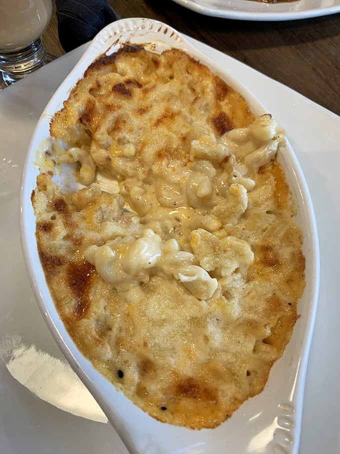 This isn't your kid's mac and cheese; it's a bubbling, golden masterpiece that would make even the Queen request seconds.