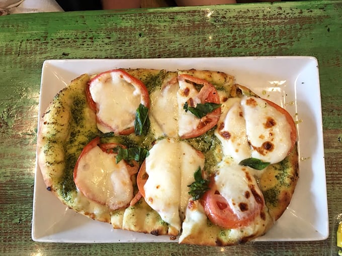 This flatbread would make an Italian grandmother nod in approval. Simple, perfect, and likely to disappear faster than a minnow near a barracuda.