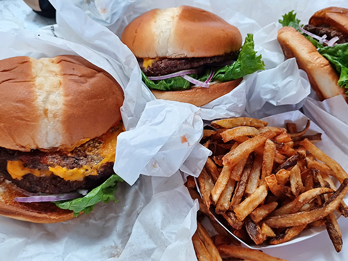 A feast fit for royalty served on humble paper. These burgers and fries don't need fancy plating when they taste like they've been blessed by the comfort food gods.