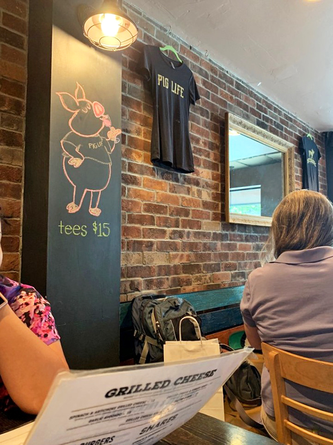 Even the walls tell stories here, with "Pig Life" merchandise that lets you take home the spirit if not the mac and cheese. The chalk pig drawing adds whimsical charm.