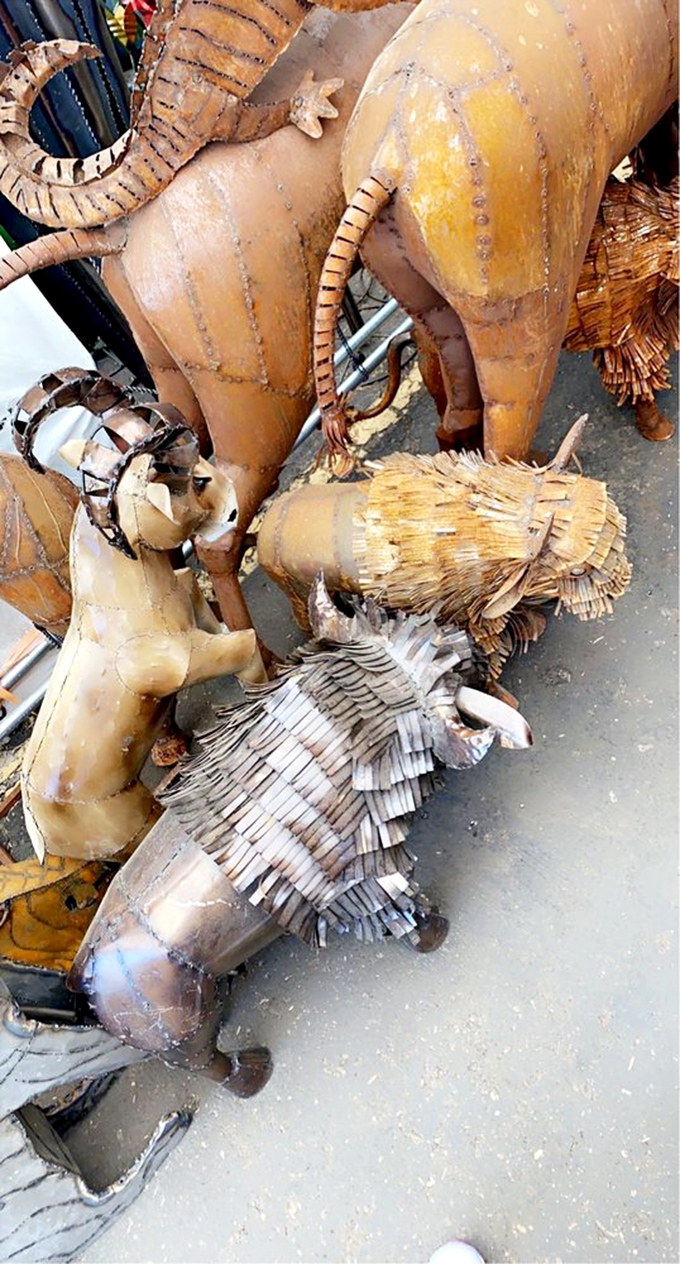 These aren't your ordinary lawn ornaments—handcrafted metal wildlife captures the spirit of the Southwest without requiring a drop of water.