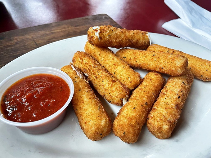 Mozzarella sticks: the universal language of appetizer joy. These golden beauties promise the perfect cheese pull that makes everyone at the table gasp.