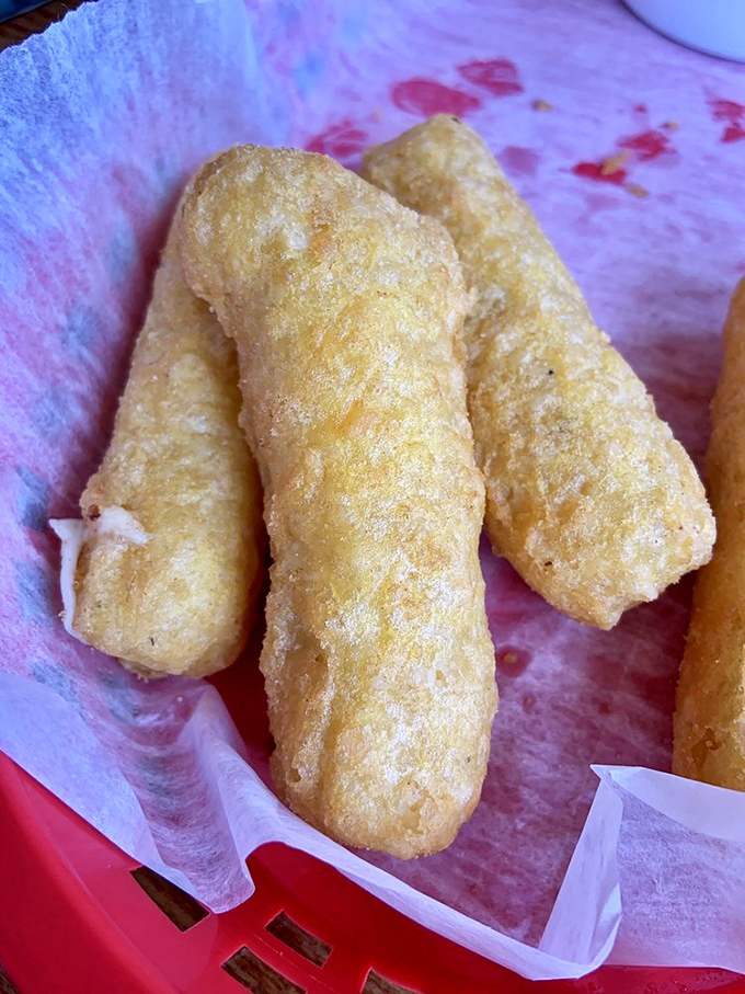 Not just mozzarella sticks&mdash;they're golden wands of cheese magic. Crispy outside, molten inside, and worth every napkin you'll need.