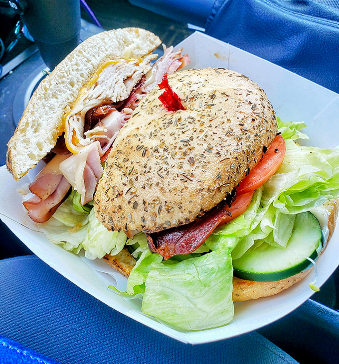 This isn't just a sandwich; it's an architectural achievement with layers that tell a story of perfect ingredient balance and structural integrity.