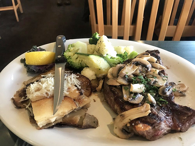 Land meets sea on this plate&mdash;a perfectly seared steak sharing real estate with mushrooms and fresh vegetables. For those moments when you're seafood-adjacent.