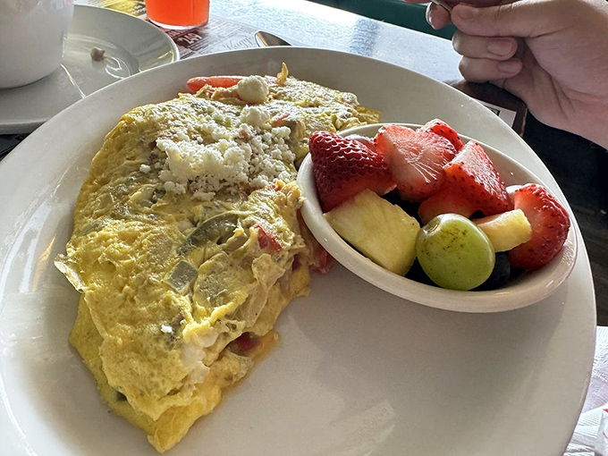 This fluffy omelet paired with fresh fruit proves that balanced eating can still feel like pure indulgence.