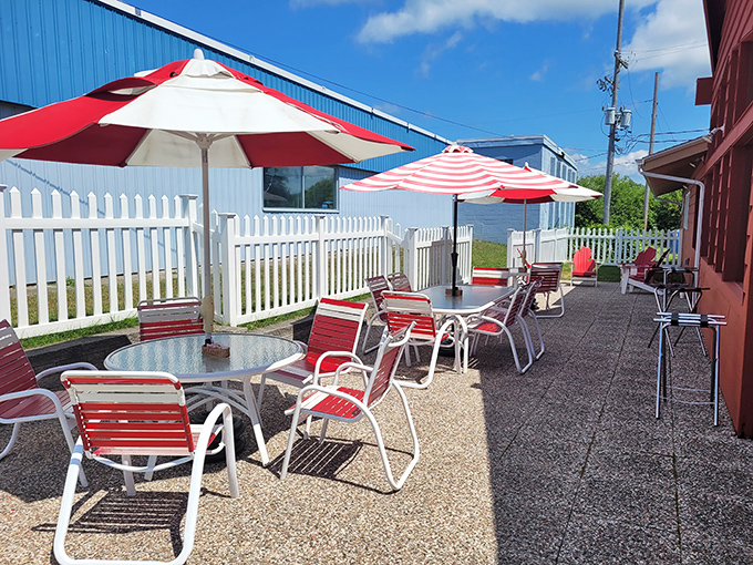 Outdoor seating with cherry-red umbrellas, because even your al fresco dining experience should maintain the proper cherry-themed color coordination.