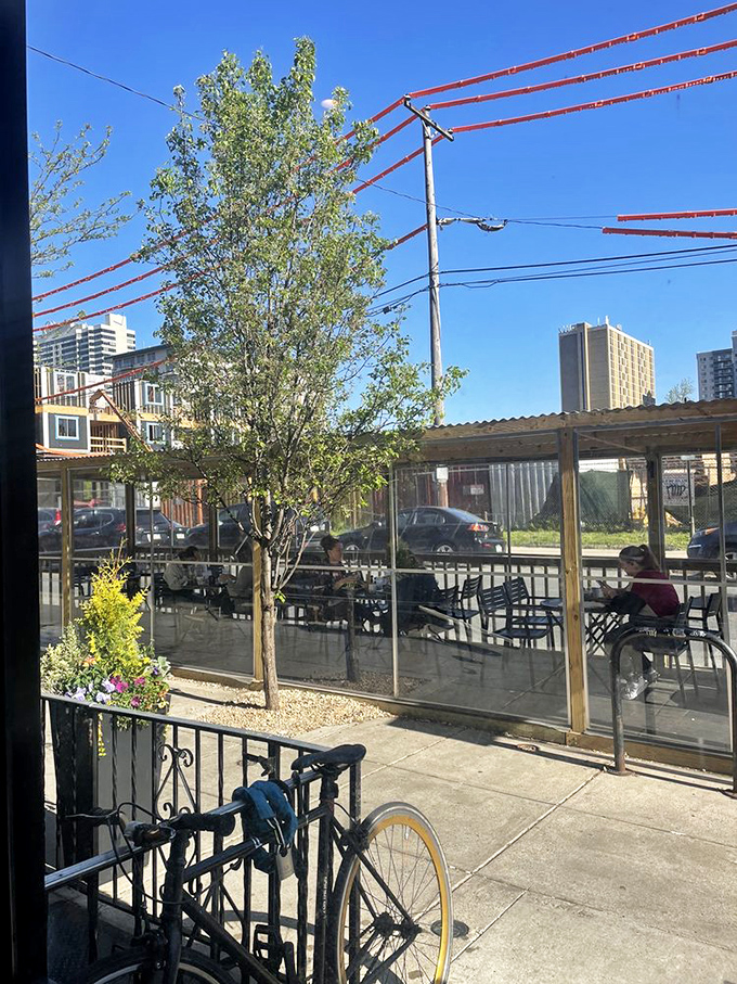 The outdoor seating area offers urban breakfast bliss. Nothing says "perfect morning" like fresh air and imminent pancakes.