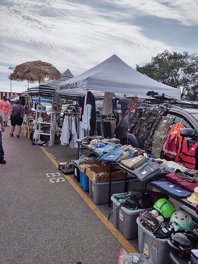 The outdoor vendor area transforms ordinary parking spaces into retail real estate where everything from clothing to camping gear finds new homes.