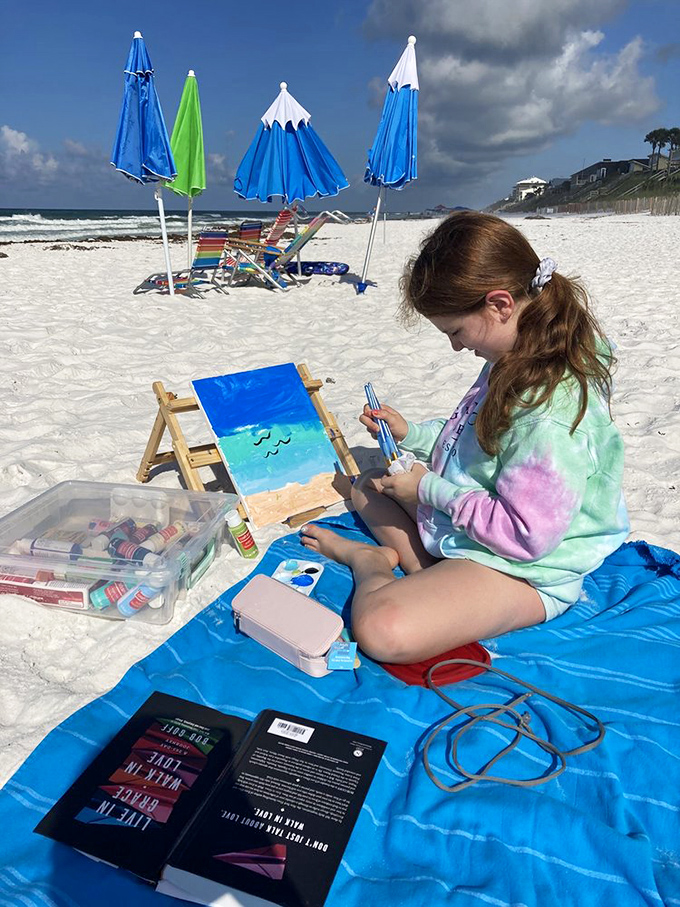 Young artist capturing the scene better than any smartphone ever could&mdash;proof that some vacation memories deserve more than just a quick snap.