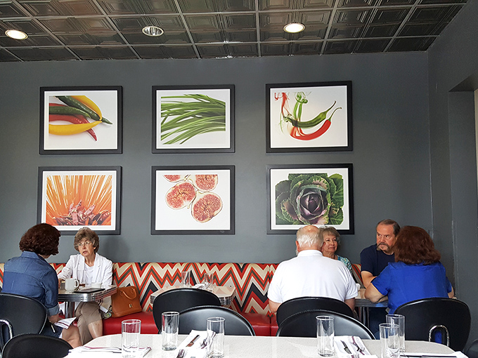 Wall art that celebrates ingredients rather than pretentious food philosophy&mdash;a visual appetizer before the main event arrives at your table.