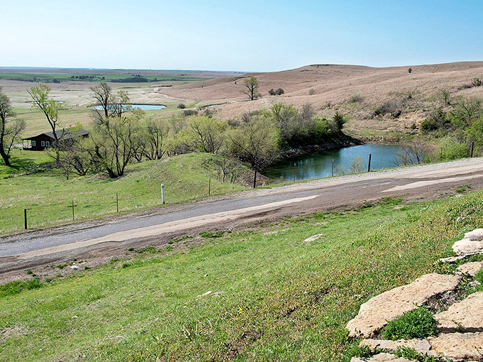 The rolling hills of Osage County unfold like a watercolor painting, their gentle contours hiding centuries of stories beneath that impossibly blue sky.
