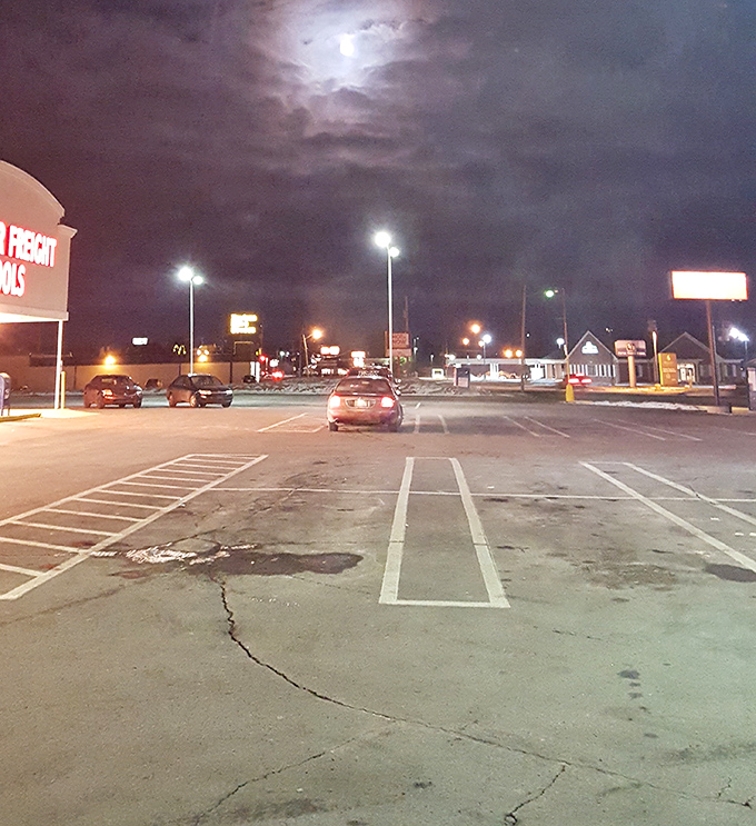 Nighttime at the savings oasis. Even under moonlight, the siren call of affordable shopping beckons to late-night bargain seekers.