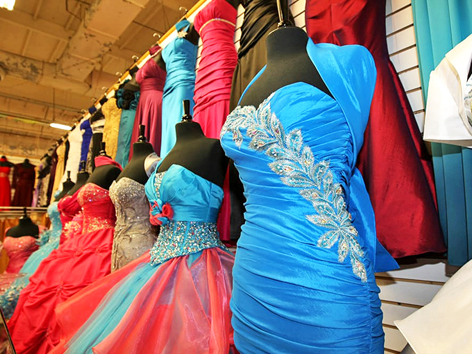 Quincea&ntilde;era and prom dresses in jewel tones stand at attention like fabric soldiers, each one ready to play a starring role in someone's coming-of-age story.