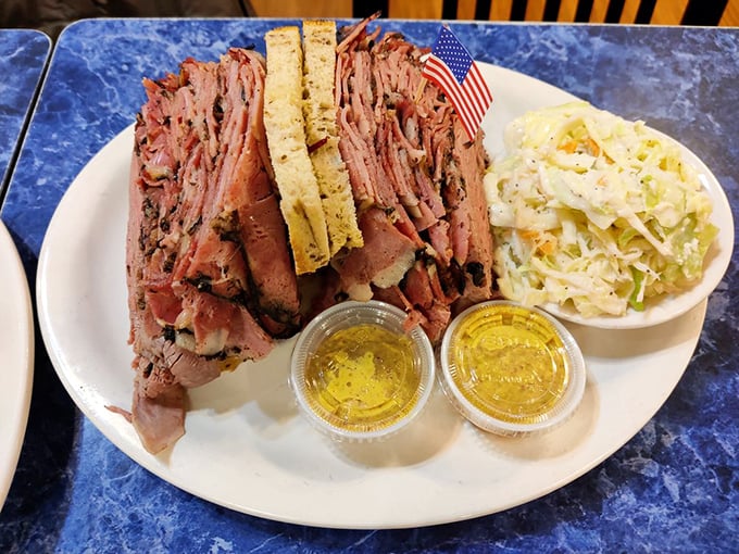 This sandwich contains more meat than most people eat in a week. The coleslaw looks like it's there just to witness the spectacle.