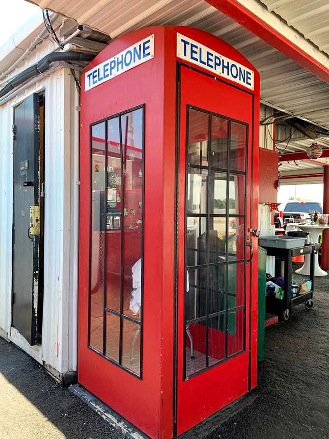 A British phone booth in Florida? This charming anachronism stands guard outside, as if Superman might emerge with a milkshake in hand. 