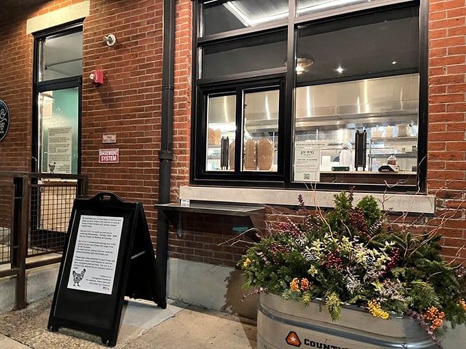 A window to wonderland. The pickup counter where dreams come true in cardboard boxes lined with branded paper. 