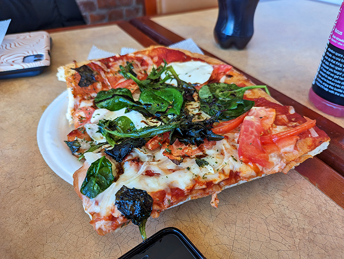 This isn't just pizza&mdash;it's a rectangular masterpiece of crisp crust, tangy sauce, and fresh toppings that makes chain delivery seem like a sad compromise.