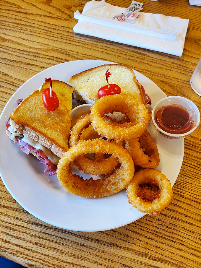 The Reuben sandwich and onion rings combo &ndash; where golden-fried circles serve as delicious bodyguards for a sandwich stuffed with enough meat to make a vegetarian weep.