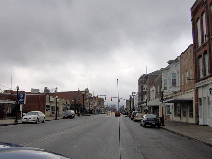 Main Street on a cloudy day&mdash;where even under gray skies, the historic charm of Delphos shines through with steadfast Midwestern resilience.