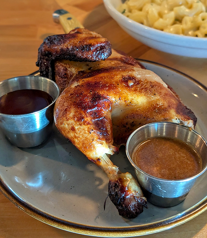 The star of the show: rotisserie chicken with golden, crackling skin and two dipping sauces. Perfection doesn't need much explanation.