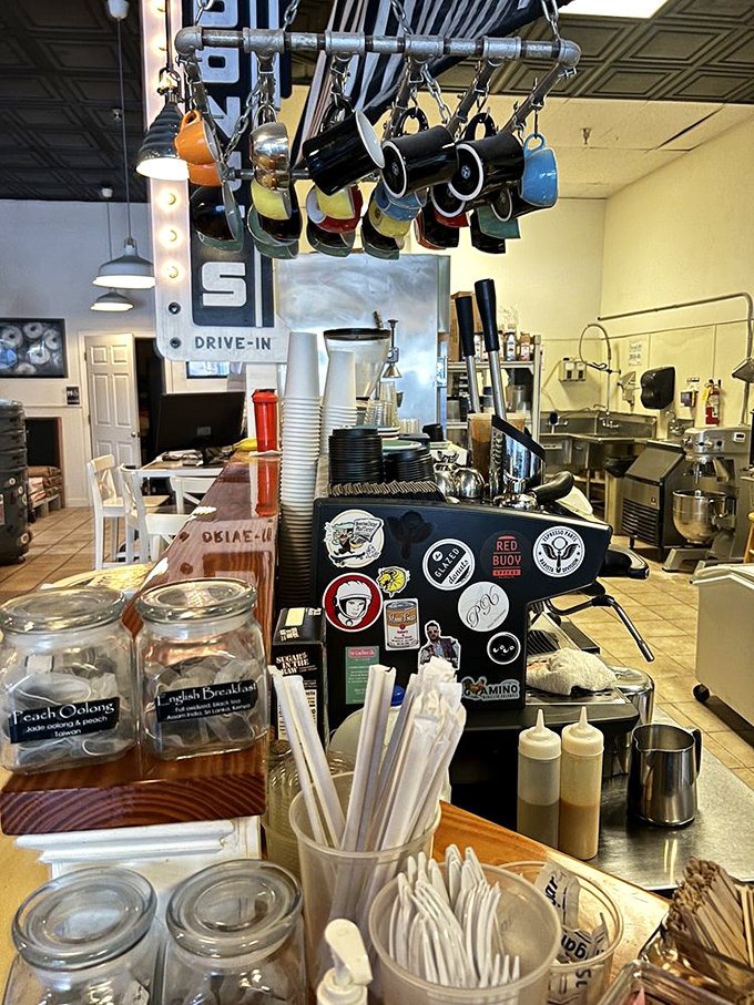 Coffee mugs dangle overhead like colorful pendulums, counting down the moments until your next caffeine fix.