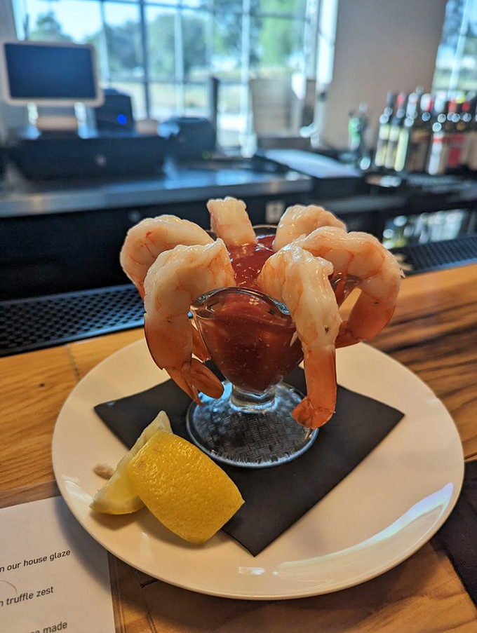 Shrimp cocktail reimagined as an elegant crown around a glass of tangy sauce&mdash;seafood that knows it deserves the royal treatment.