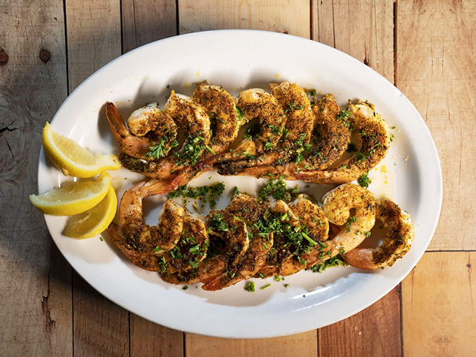 Blackened shrimp lined up like soldiers ready for battle &ndash; the battle being which one gets dipped in butter first.