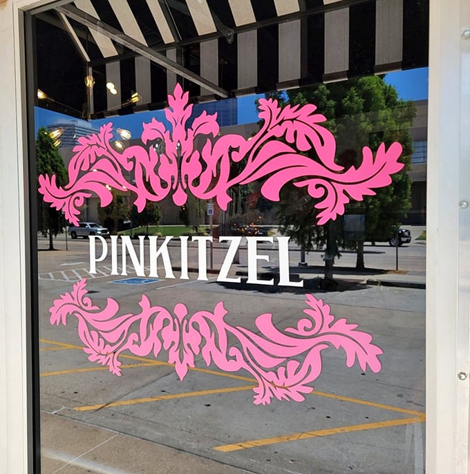 The ornate pink flourishes framing the logo promise that what awaits inside isn't your average sugar experience.