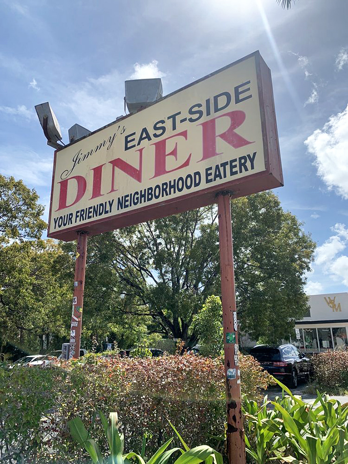 Under Miami's brilliant blue sky, Jimmy's sign stands as a beacon for those seeking refuge from trendy avocado toast empires.