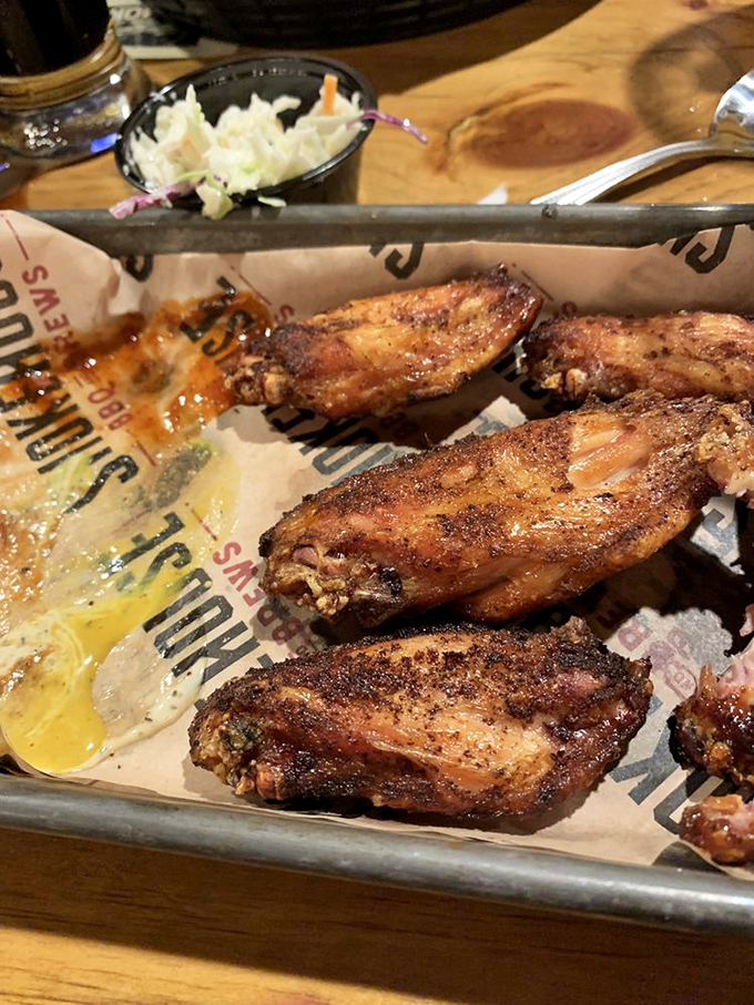 Smoked wings glistening with sauce&mdash;proof that chickens didn't evolve wings just for flying but for this glorious barbecue destiny. 