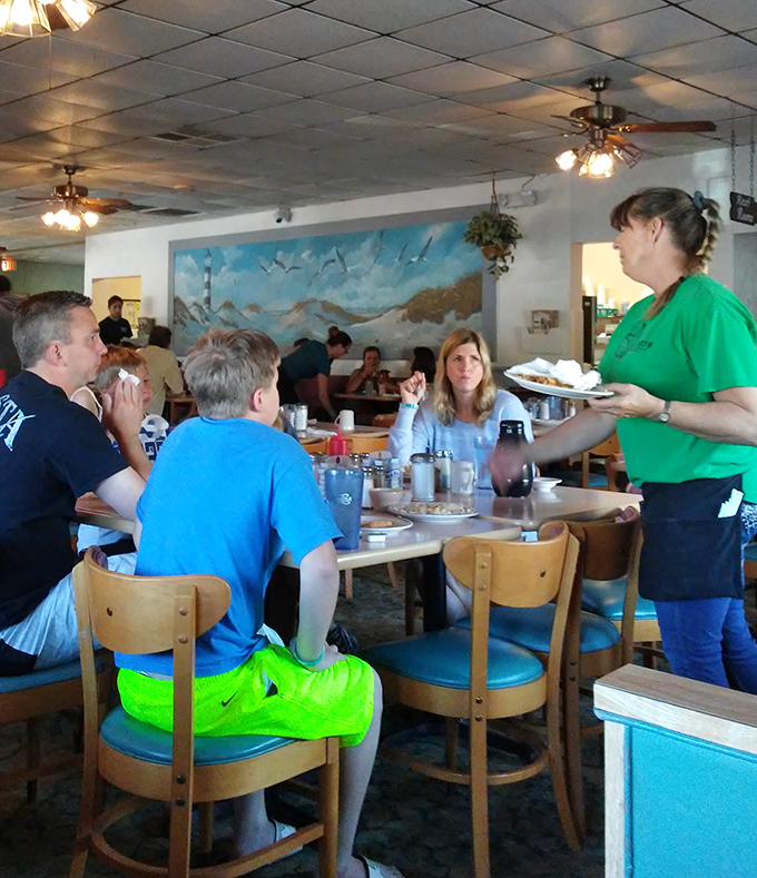 Servers who move with practiced efficiency, delivering pancake perfection with the casual confidence of breakfast professionals.