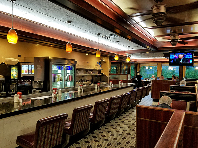 The dining room hums with conversation and the clink of silverware, a community gathering place where strangers become neighbors over coffee and pie.